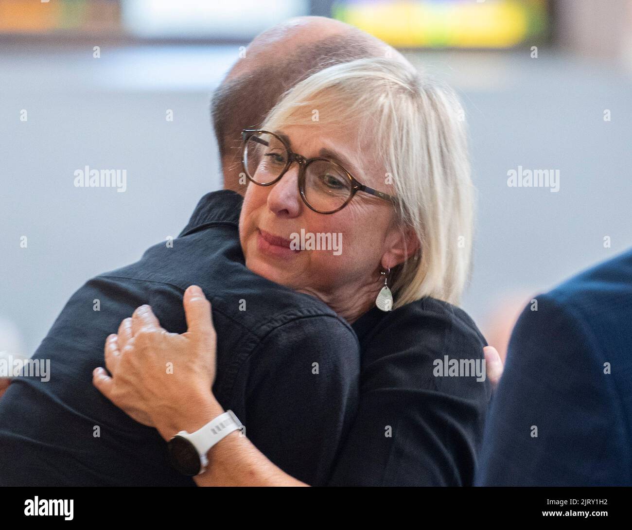 Marie-France Sirois is consoled during a service organized by the ...