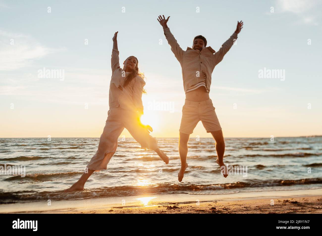 Man woman jumping summer hi-res stock photography and images - Alamy