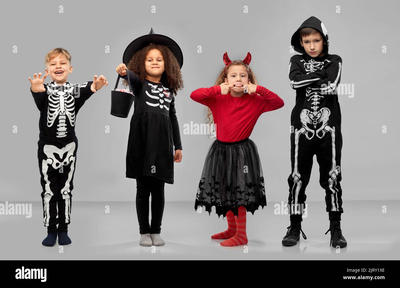 children in halloween costumes trick-or-treating Stock Photo - Alamy