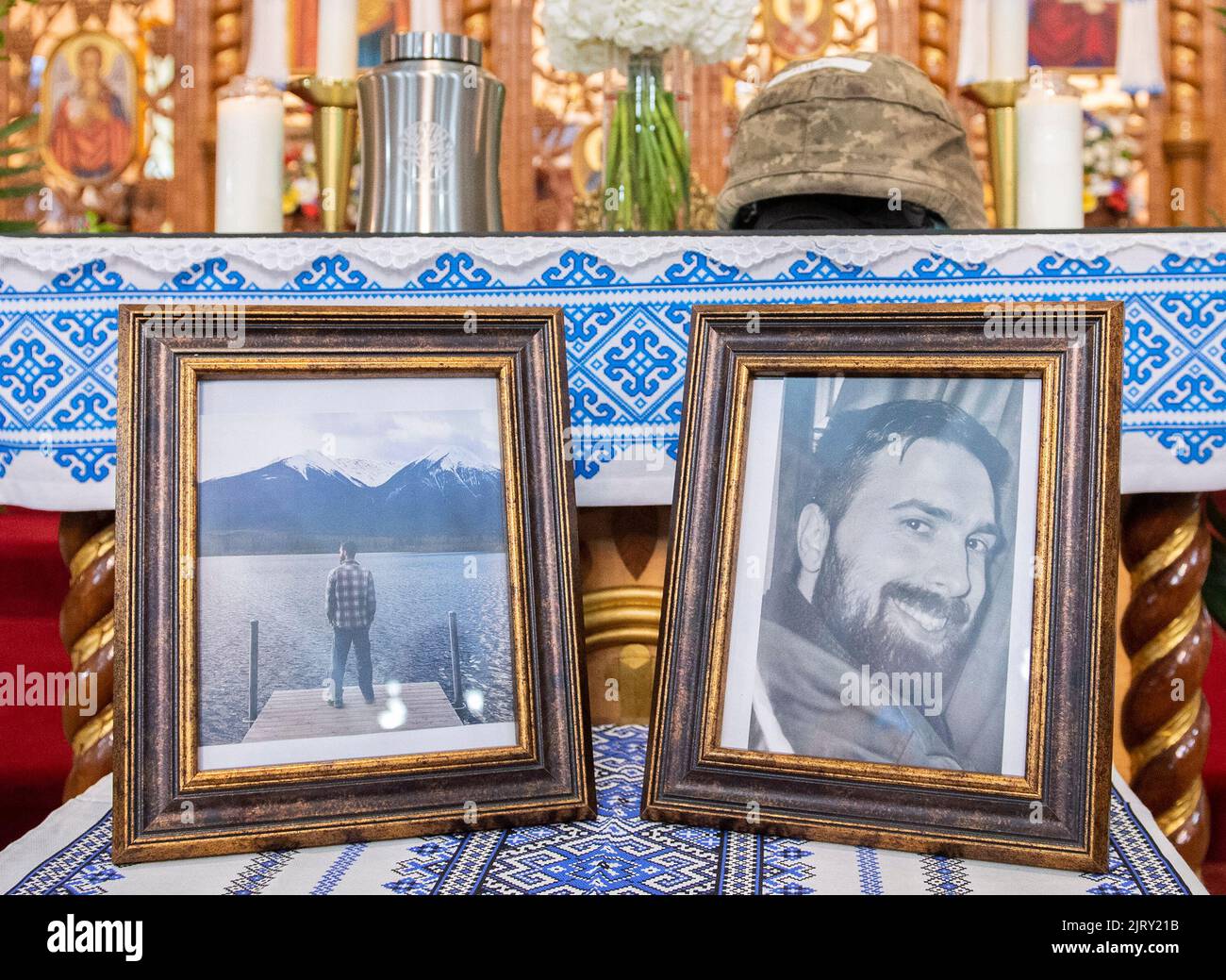 Photographs of Emile-Antoine Roy-Sirois are shown during a service ...