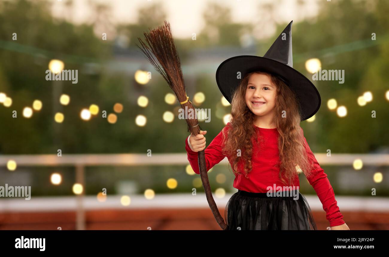 Beautiful happy witch girl broom hi-res stock photography and images ...