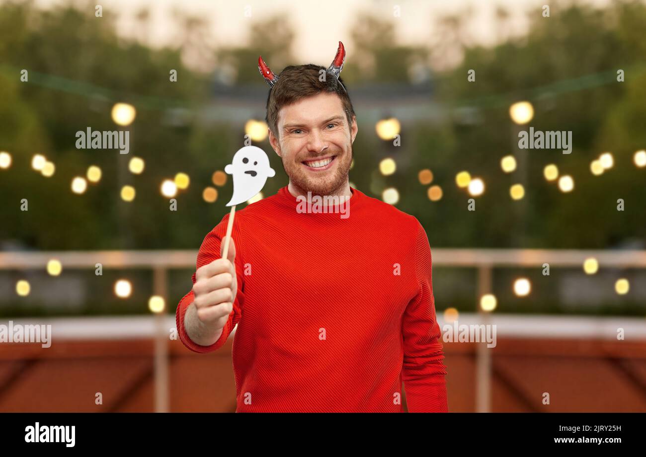 happy man in halloween costume of devil over grey Stock Photo - Alamy