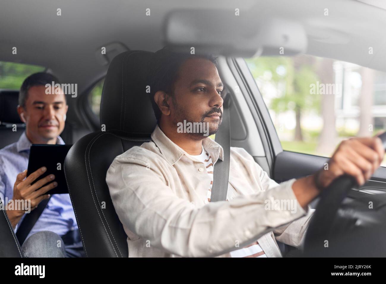 indian male driver driving car with passenger Stock Photo - Alamy