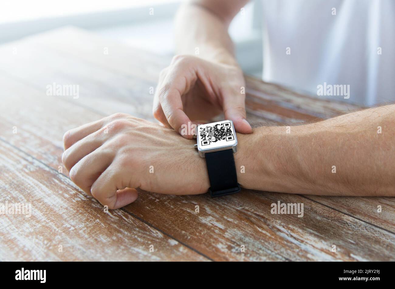 male hands with qr code on smart watch Stock Photo - Alamy