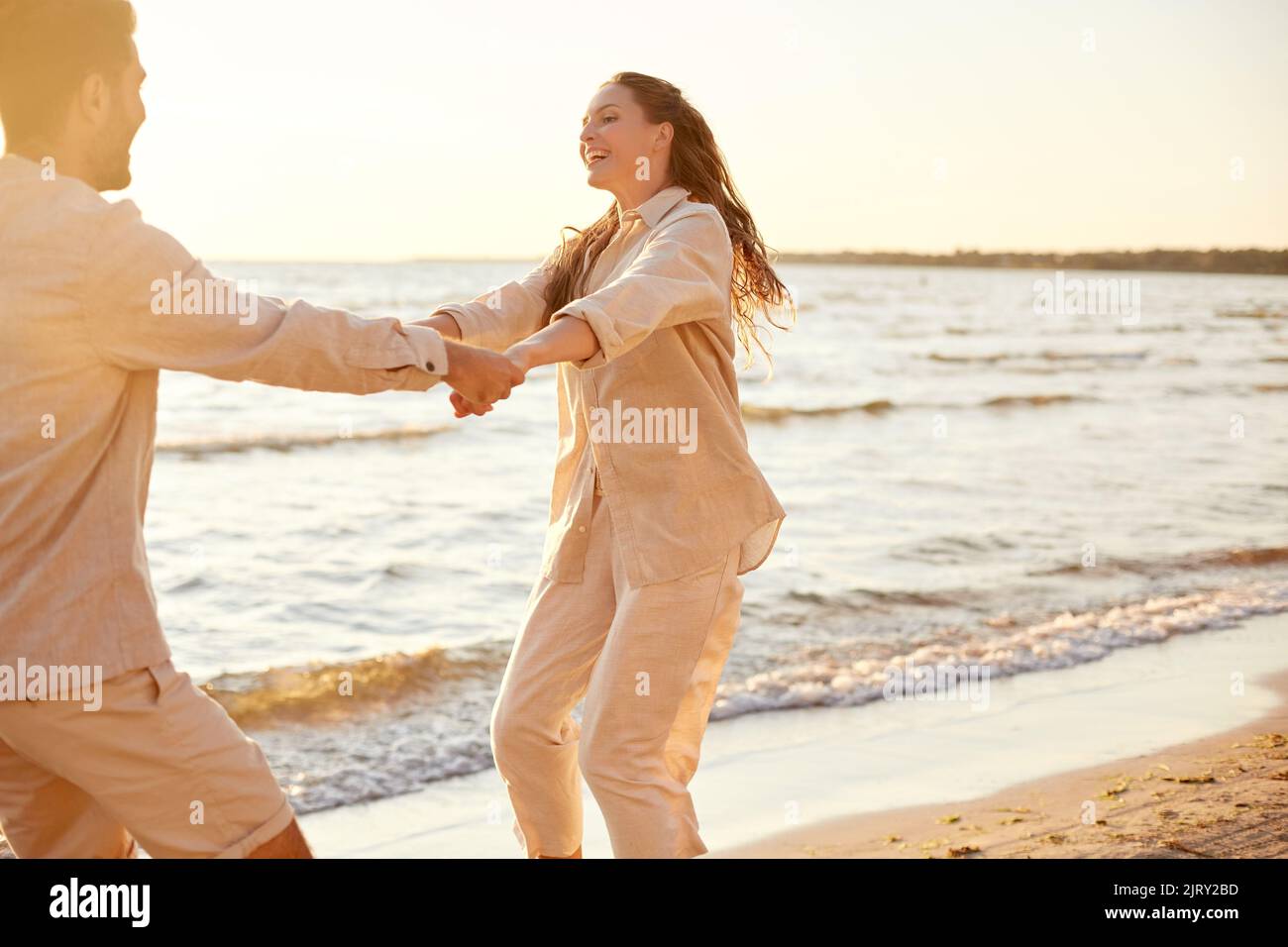 Couple happy hugging beach sunset hi-res stock photography and images ...