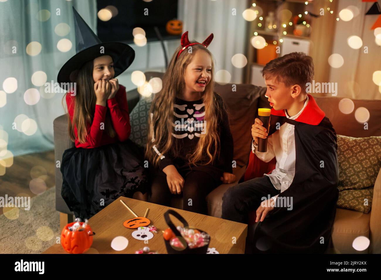 kids in halloween costumes playing at home Stock Photo - Alamy
