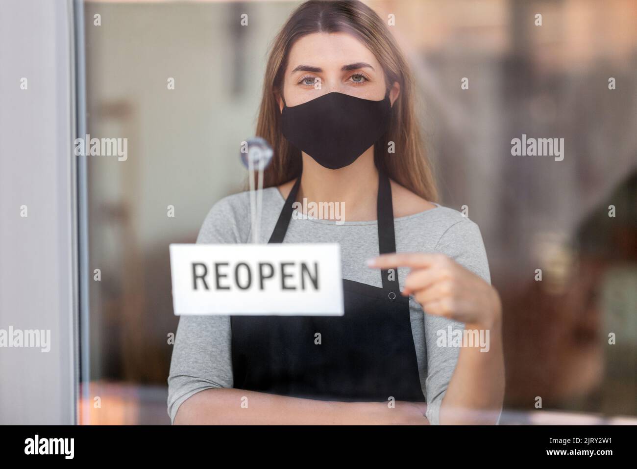 Saleswoman in mask showing hi-res stock photography and images - Alamy