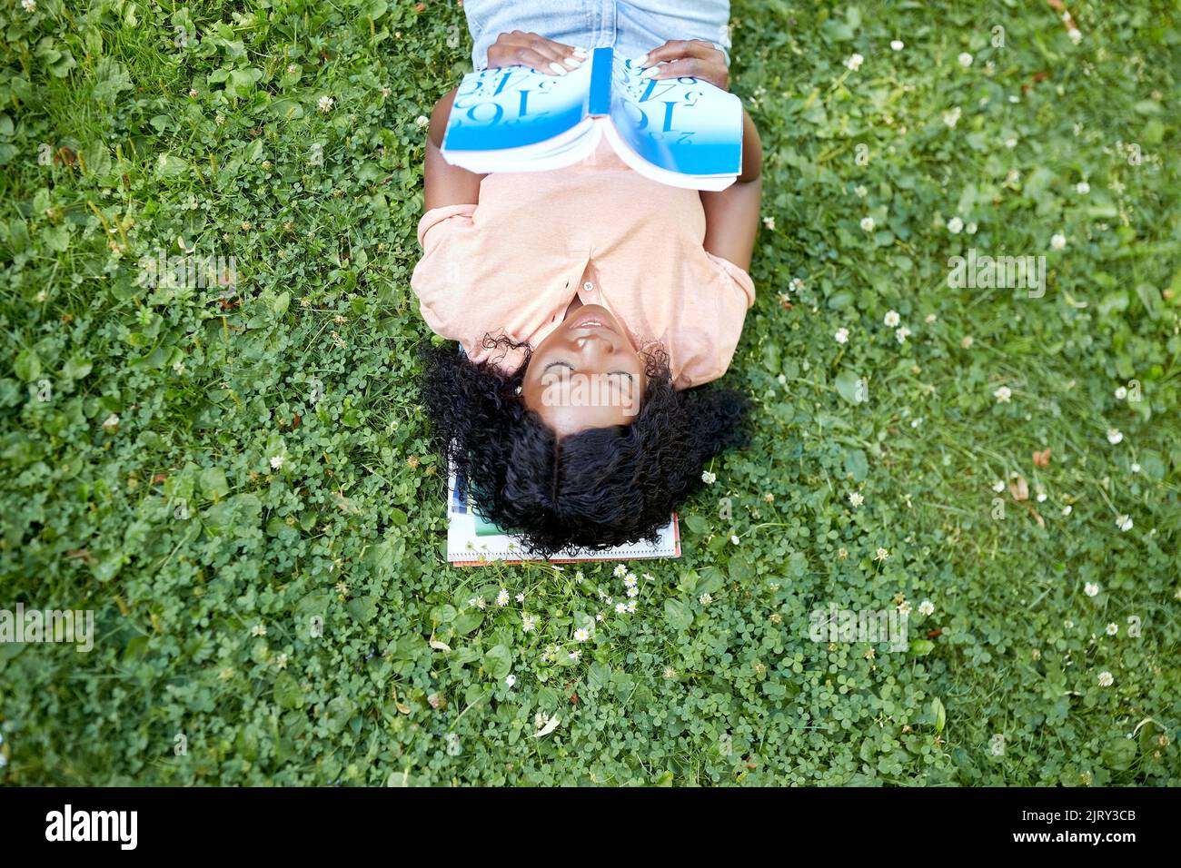 african student girl reading math textbook Stock Photo - Alamy