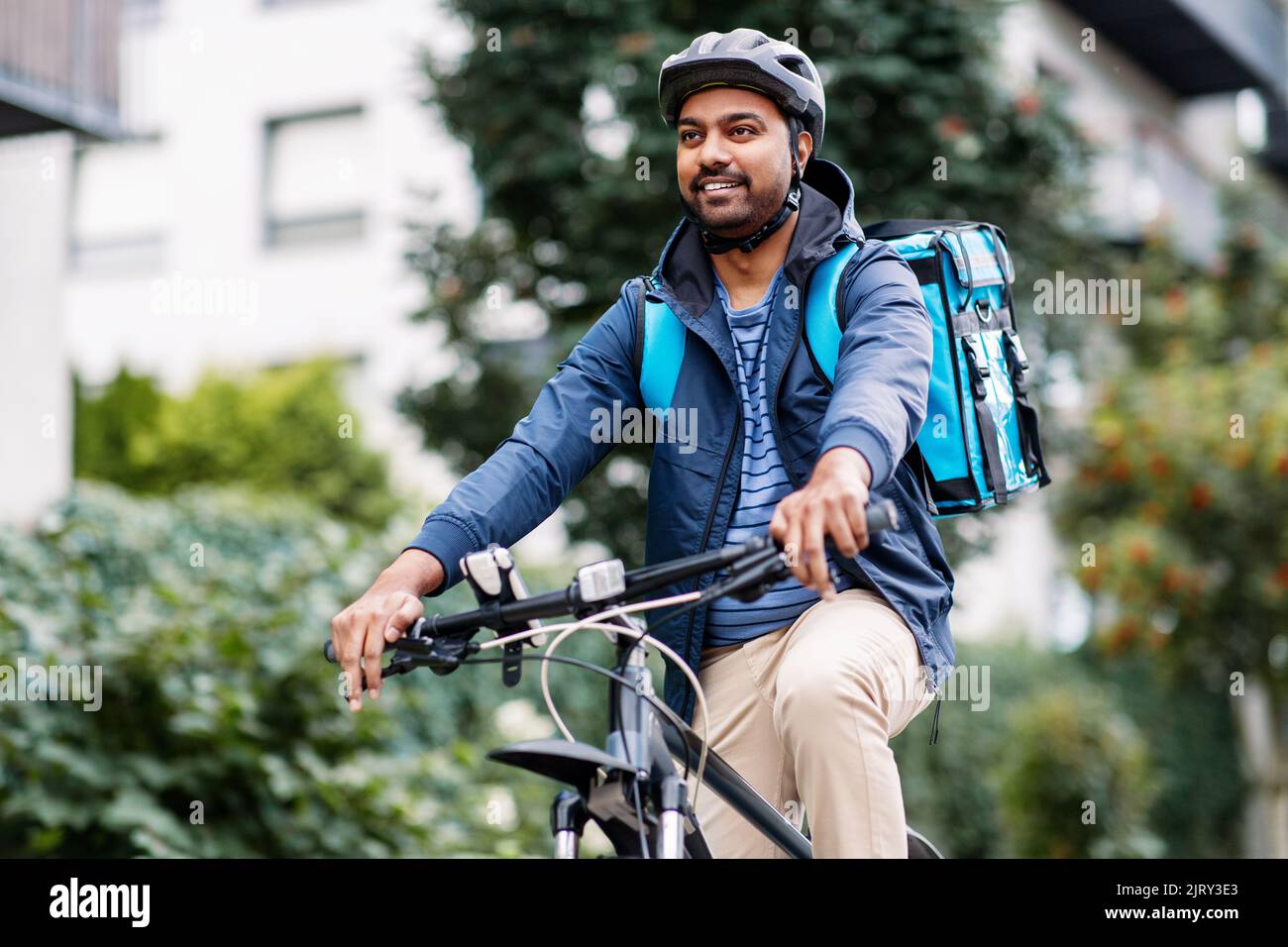 Indian man riding bicycle hi-res stock photography and images - Alamy