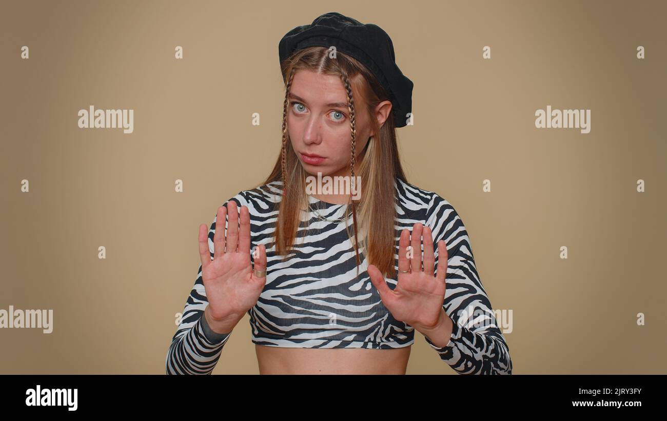 Hey you, be careful. Young woman warning with admonishing finger ...