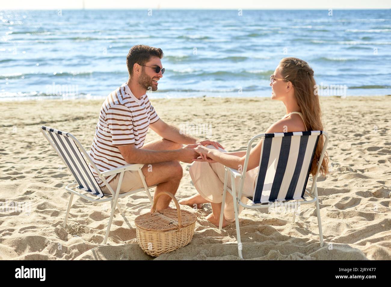 Romantic couple sitting on chair hi-res stock photography and images ...