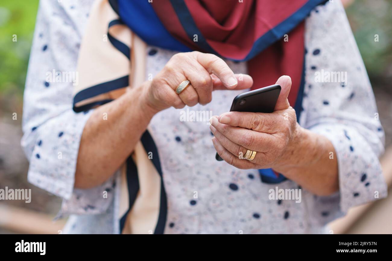 Old woman hands using smartphone texting sending messages on mobile ...