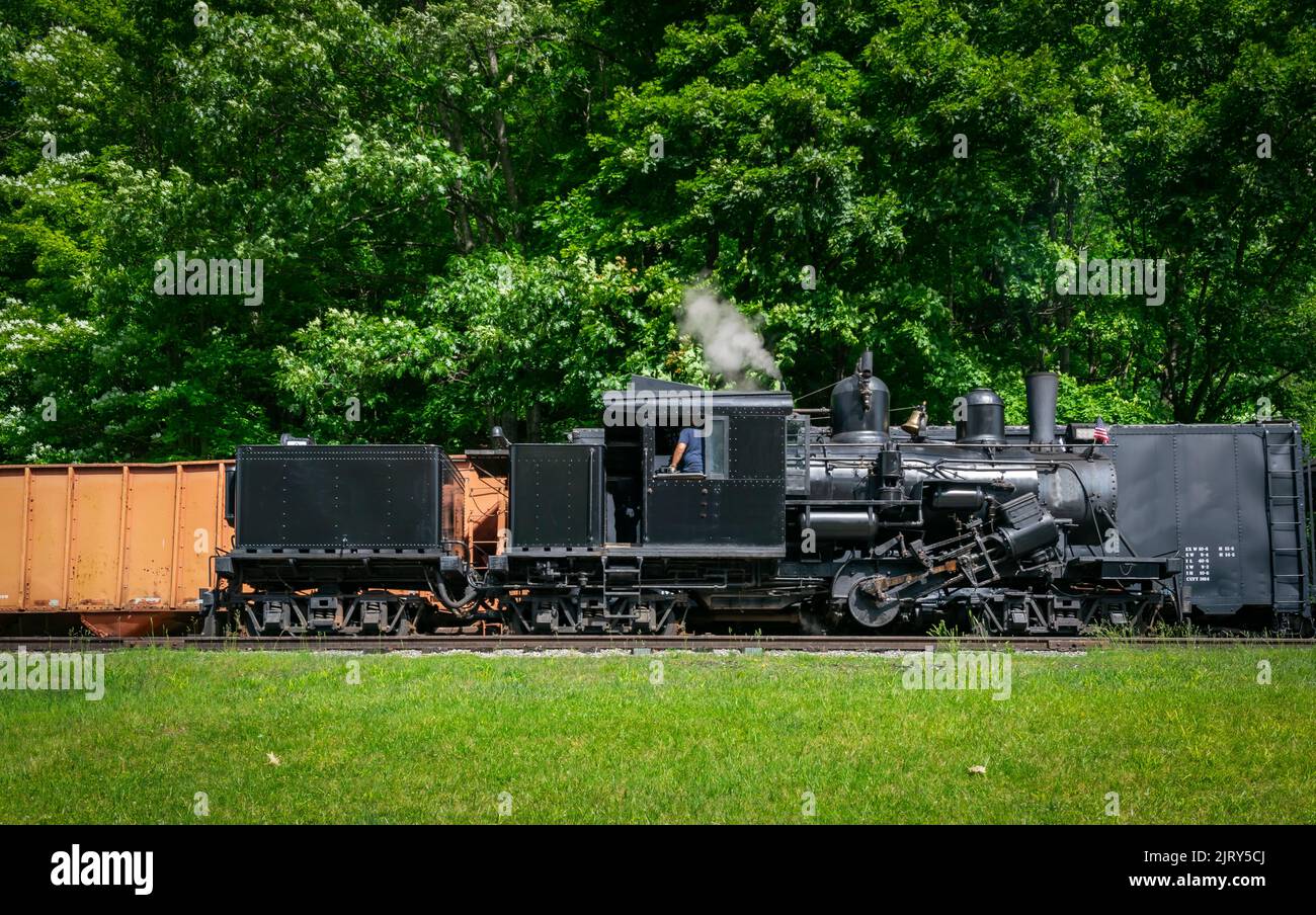 A View of a Antique Shay Steam Engine Warming Up Blowing Steam on a ...