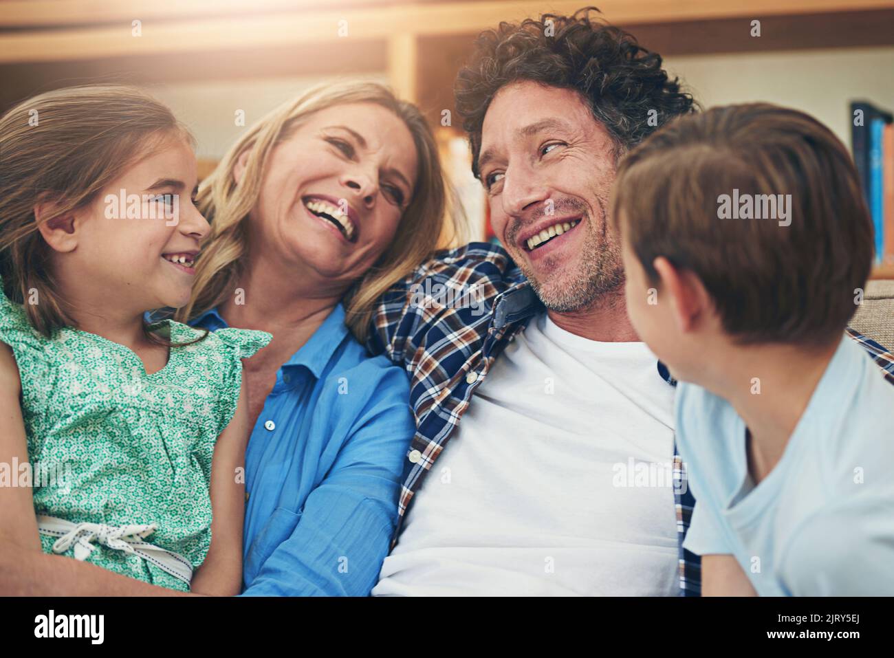 Growing up in the most loving home ever. a happy family relaxing on the sofa together at home ...