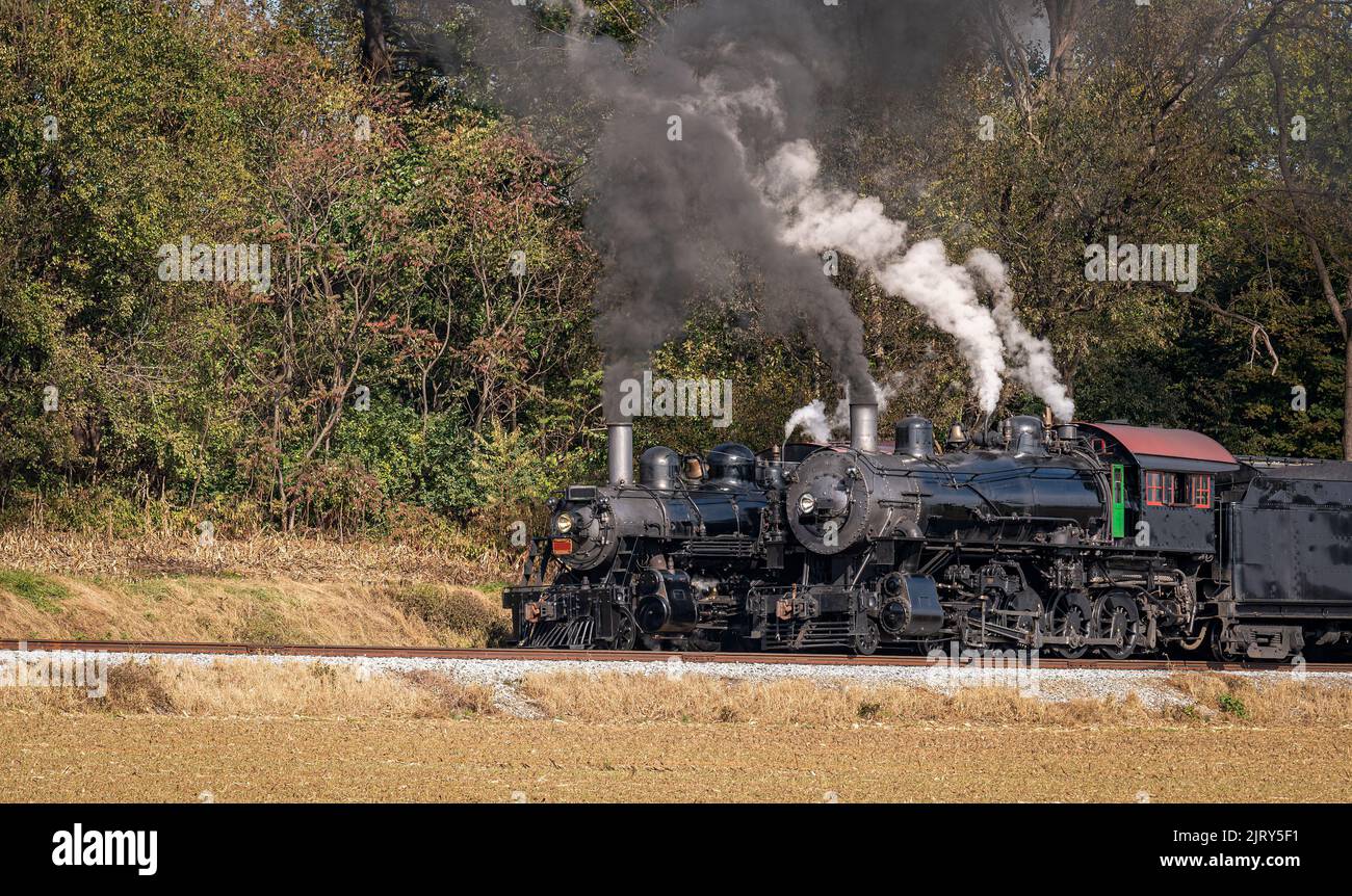 A View of Two Steam Engines, blowing Smoke and Steam Warming Up Next to ...