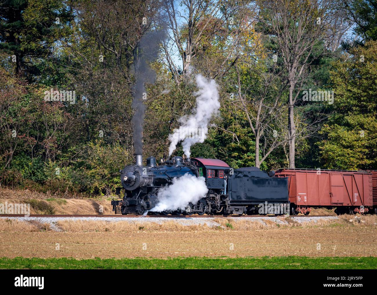 A View of a Restored Steam Freight Train Blowing Smoke and Steam ...