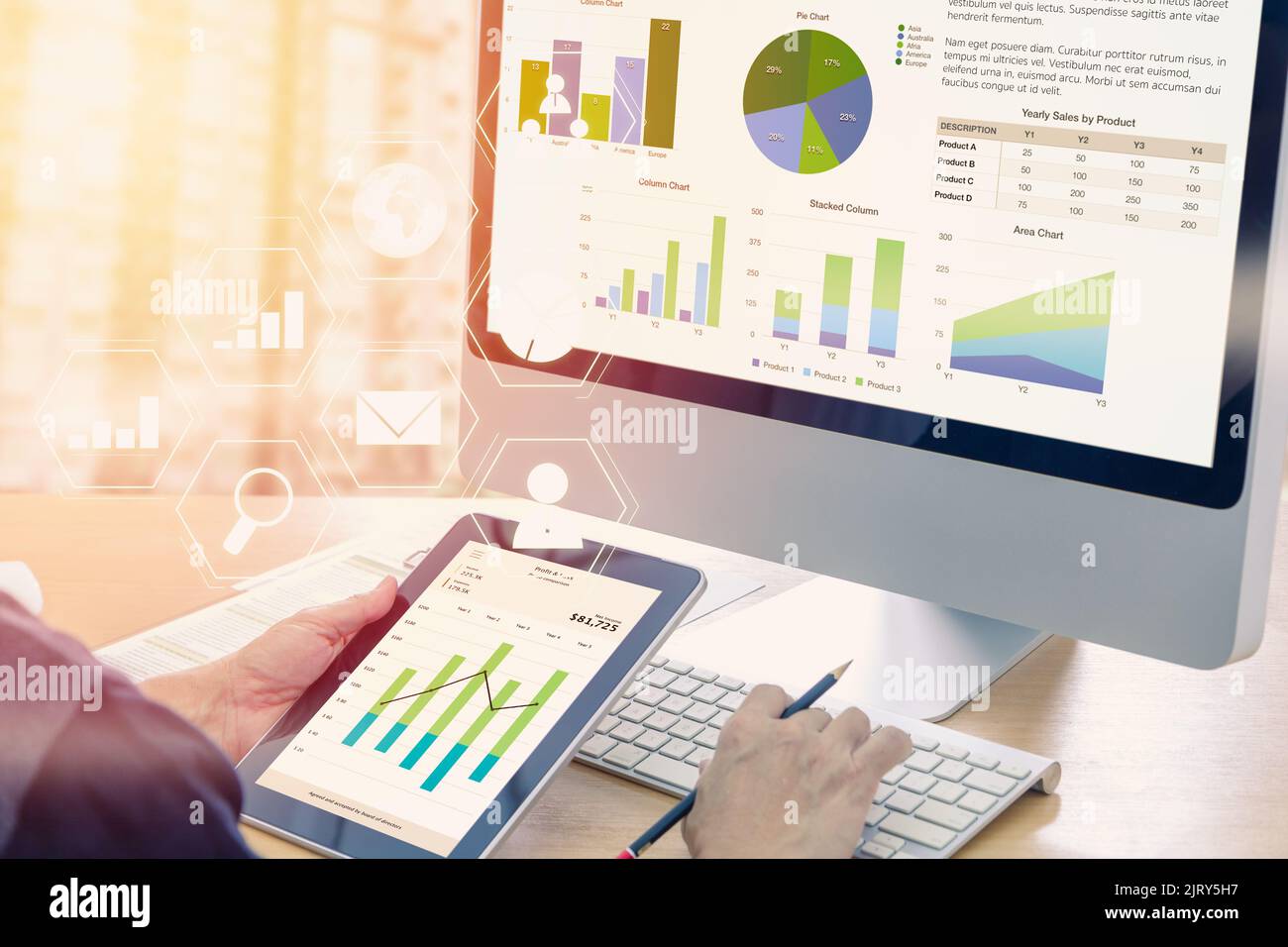 Businessman in front of modern computer with colorful pie and bar ...