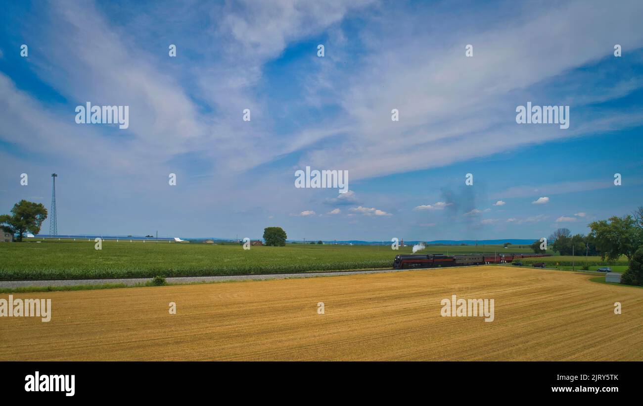 Aerial View of a Steam Passenger Train Approaching, Traveling Through ...