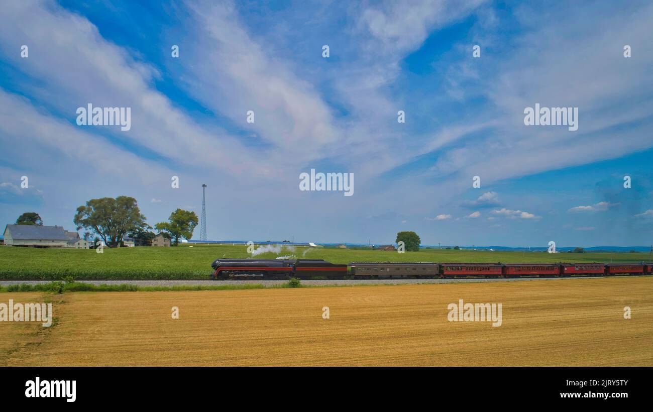 Aerial View of a Steam Passenger Train Approaching, Traveling Through ...