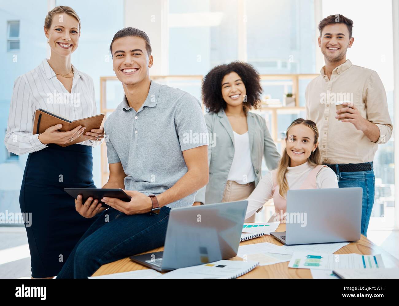 Motivation, happy teamwork and digital marketing with laptop, paper and ...