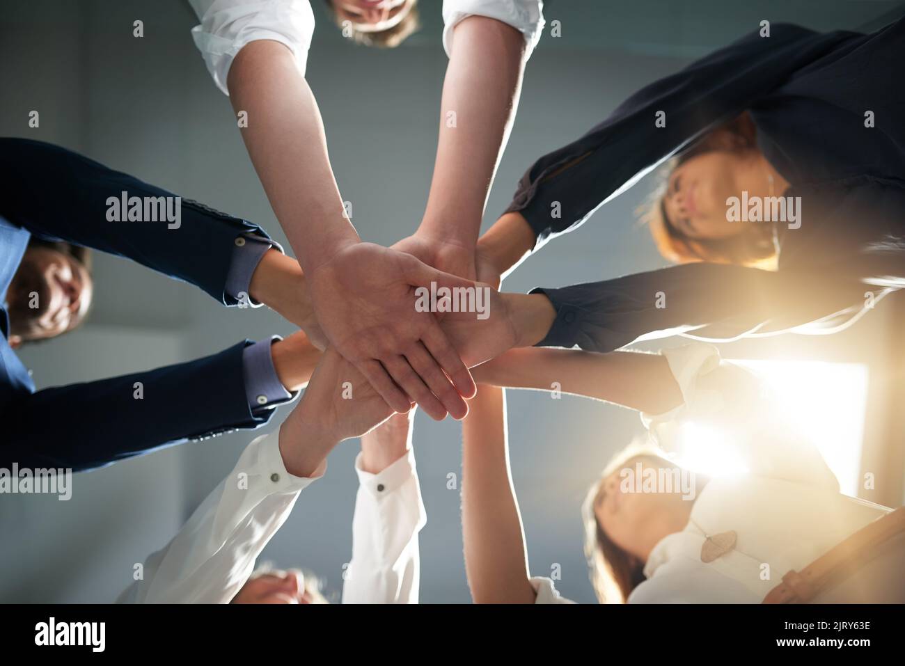 The effort of all is what counts. Low angle shot of a group of ...