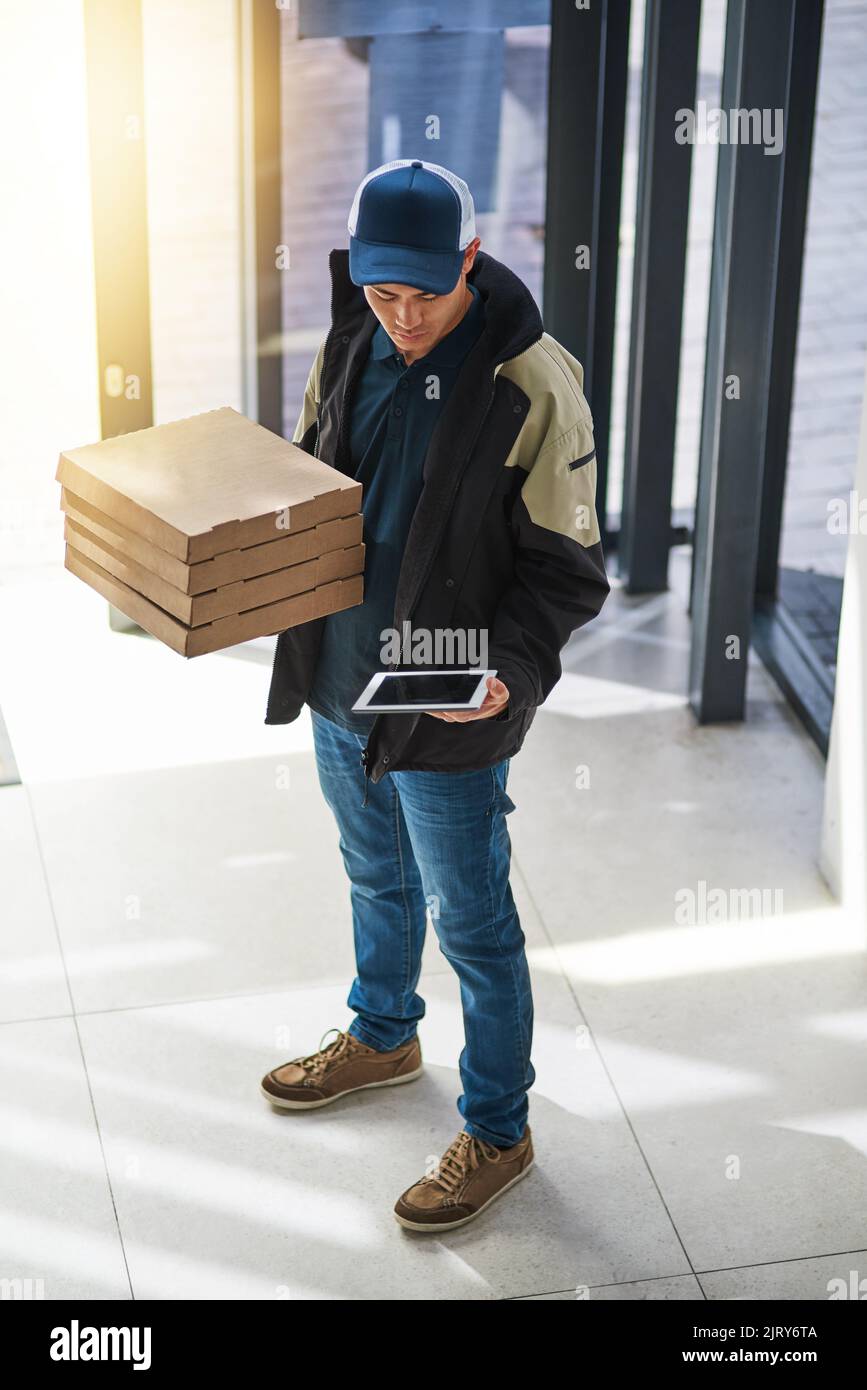 Double-checking if hes at the right location. a young man making a ...