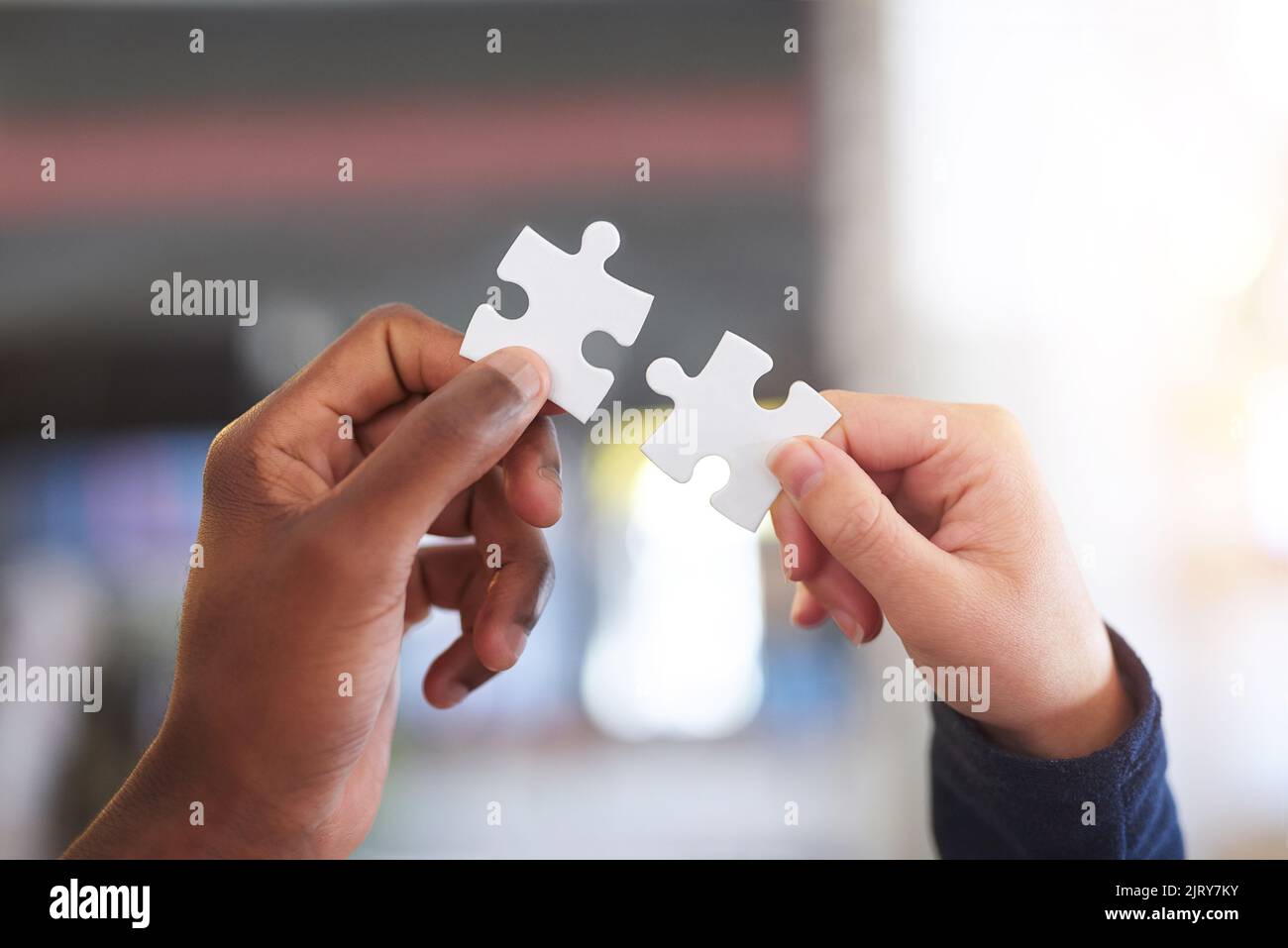 Theyre a perfect fit. two unidentifiable friends holding up puzzle ...