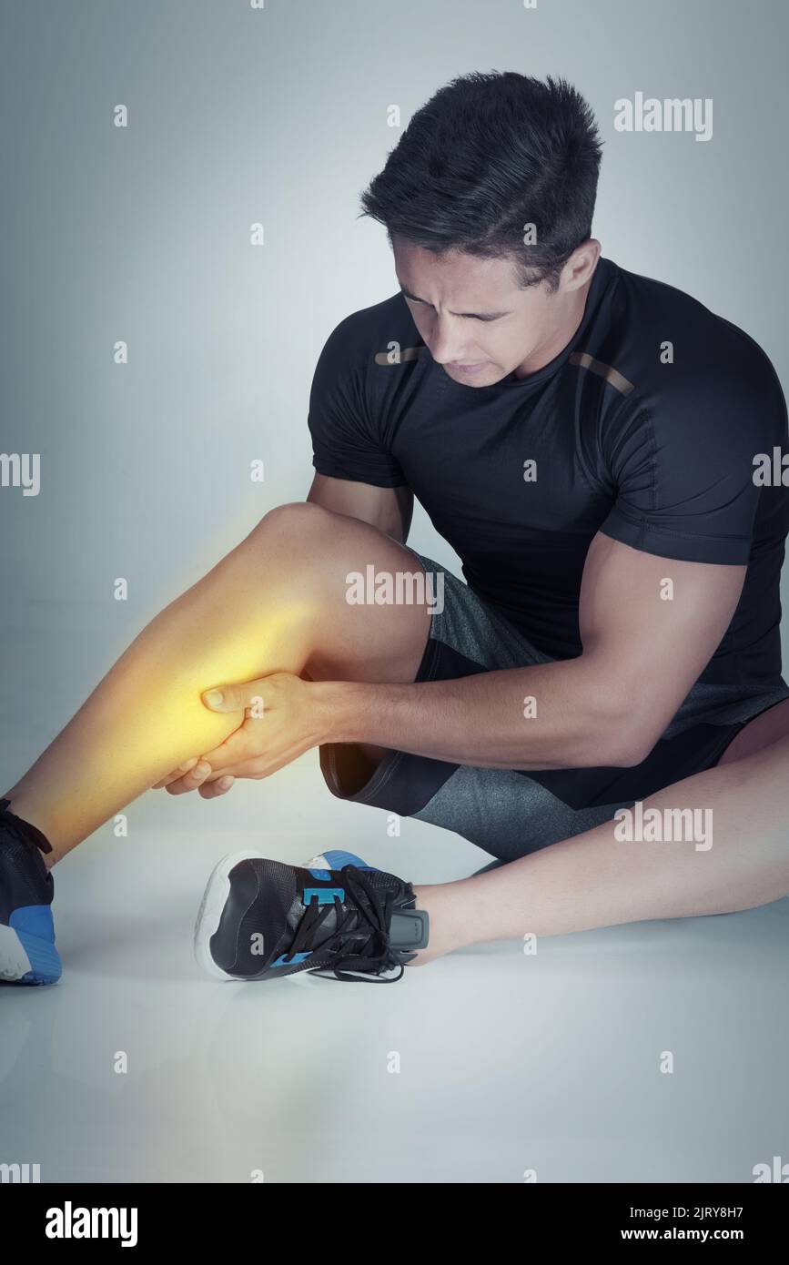 Theres always the risk of injury. Studio shot of an athletic young man ...