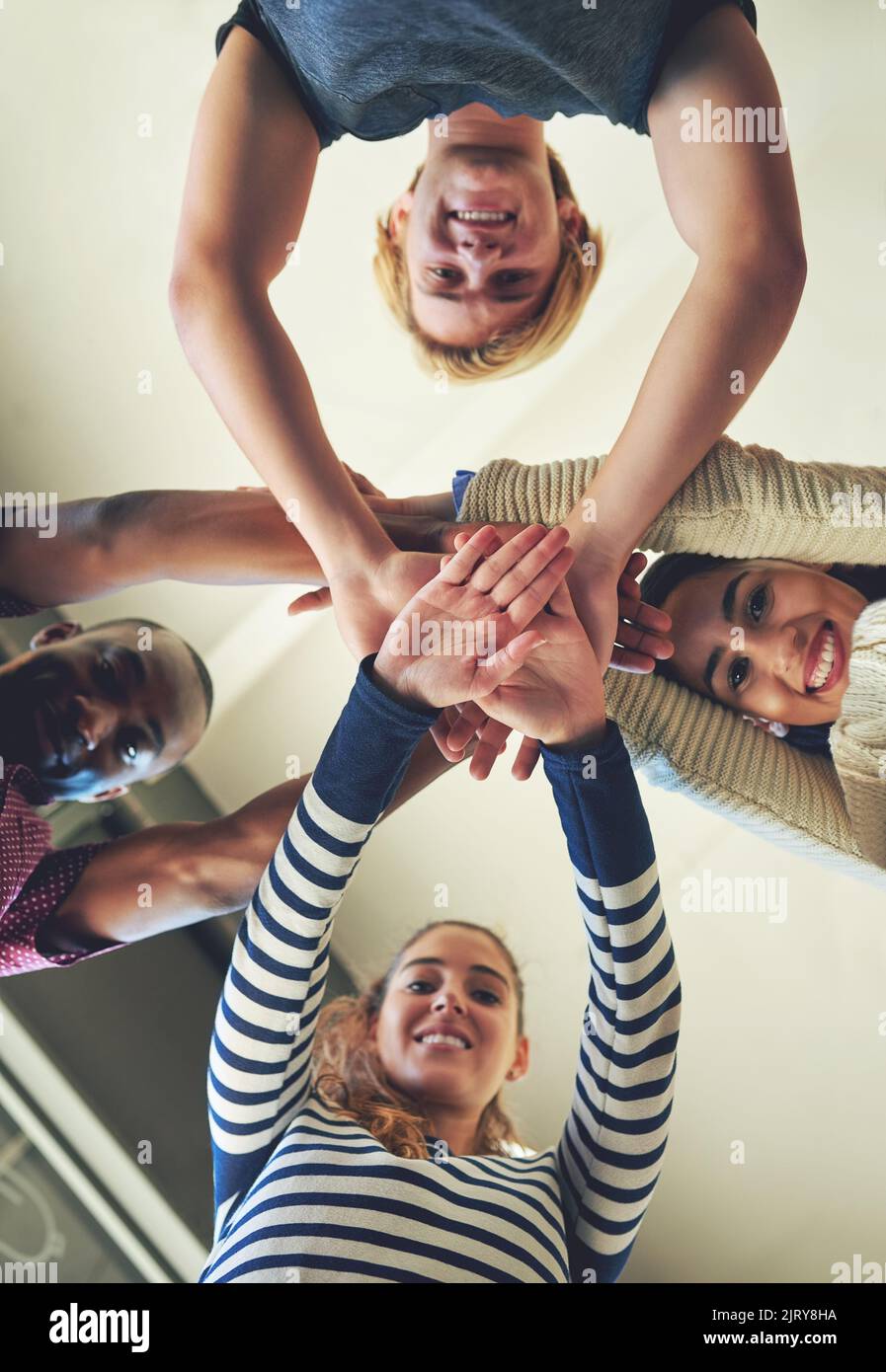 United by friendship. Low angle portrait of a group of student friends ...