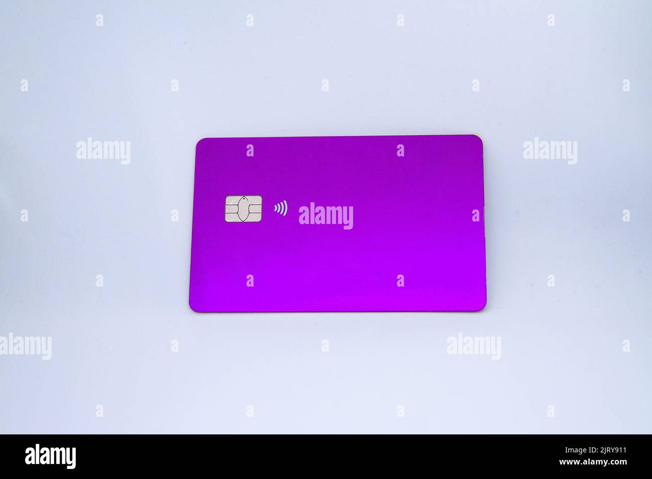 purple credit card with approach chip on a white background Stock Photo ...