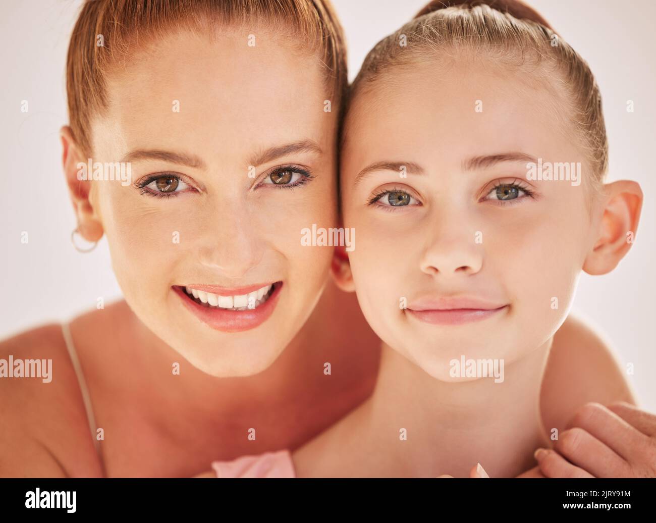 Portrait of ballet teacher with student, teaching a dance class and ...