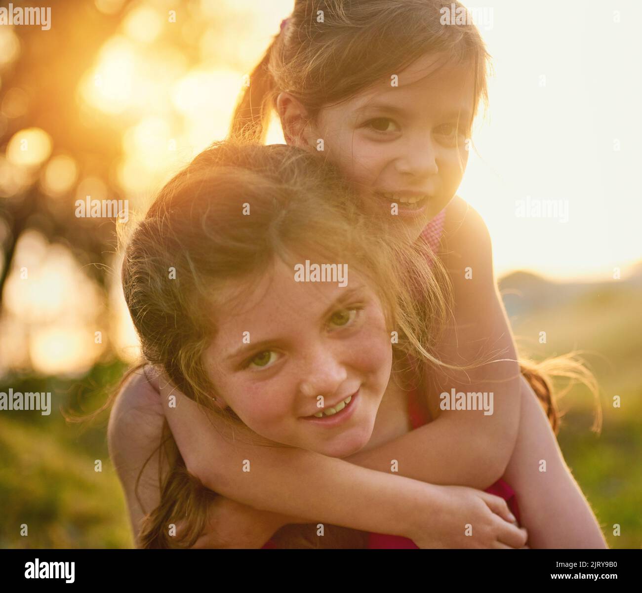 Girls just want to have fun. Portrait of two cute sisters playing ...