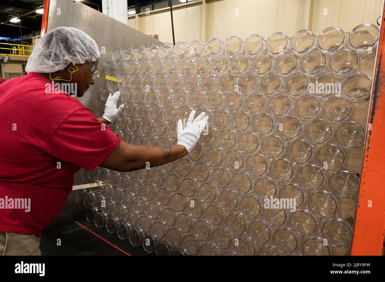 Atlanta, Georgia, USA. 3rd Aug, 2022. Worker packs just-finished wide ...
