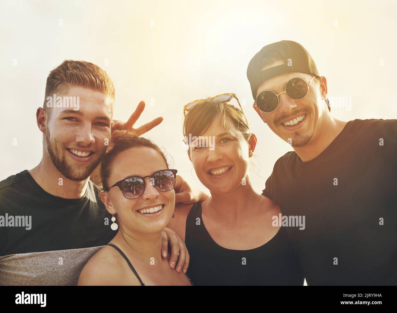 Making memories in the sunshine. Portrait of a happy group of friends ...