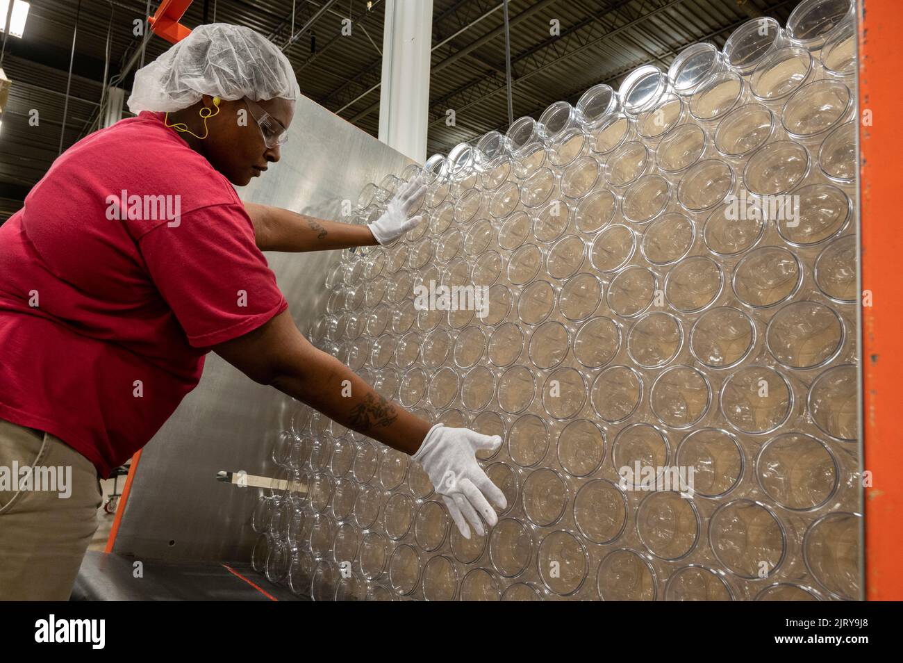 Atlanta, Georgia, USA. 3rd Aug, 2022. Worker packs just-finished wide ...