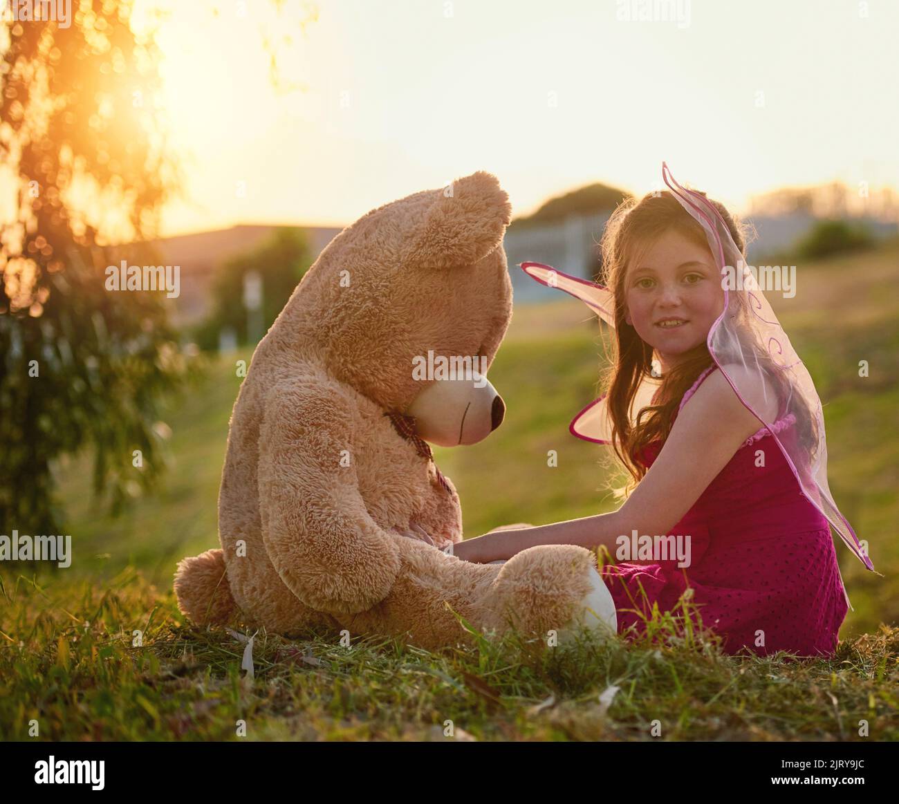 Every day is an adventure when youre little. Portrait of a cute little girl playing with a huge ...