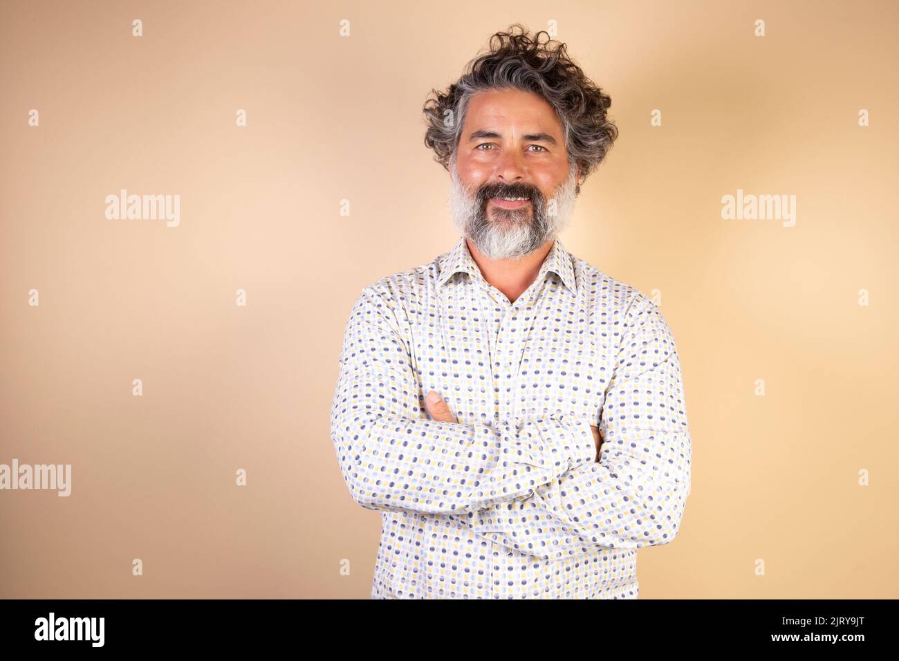 Successful middle-aged caucasian man dressed casually with arms crossed ...