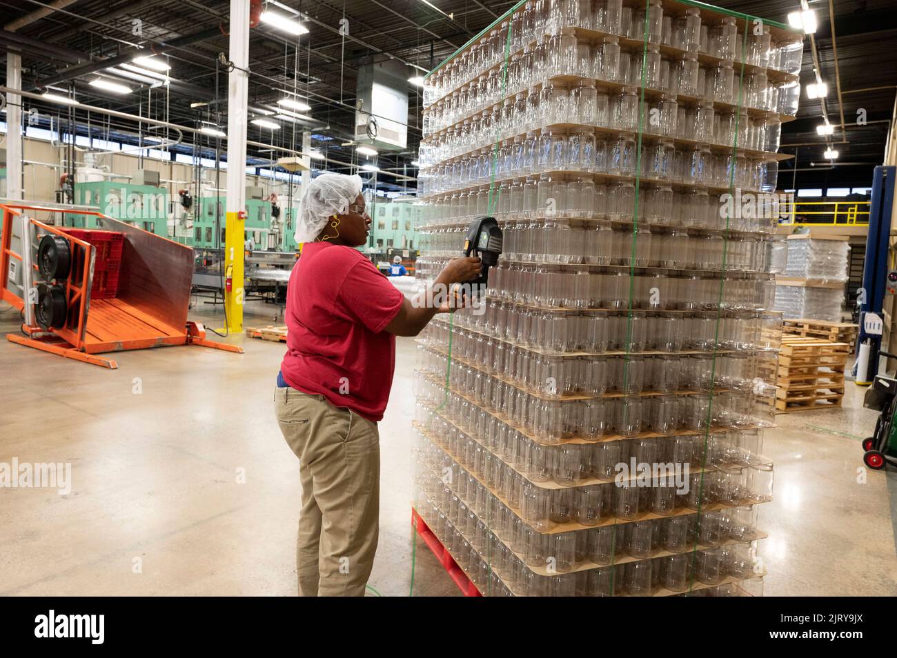 Atlanta, Georgia, USA. 3rd Aug, 2022. Worker packs just-finished wide ...
