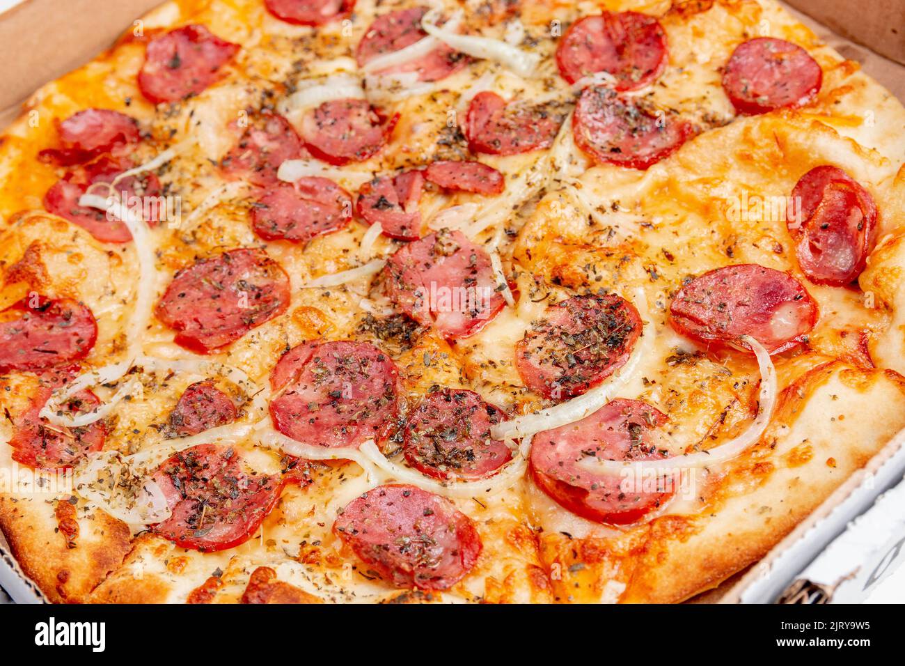 Round pepperoni pizza on a white table in Rio de Janeiro Stock Photo ...