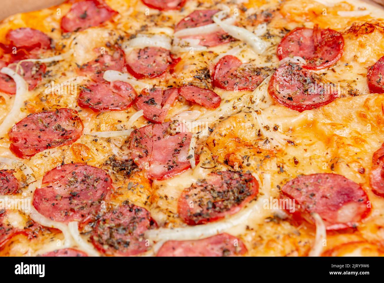 Round pepperoni pizza on a white table in Rio de Janeiro Stock Photo ...