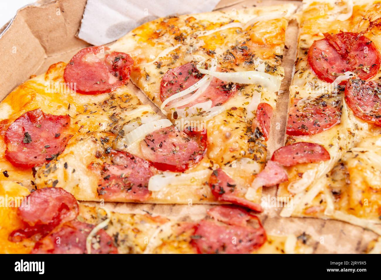 Round pepperoni pizza on a white table in Rio de Janeiro Stock Photo ...