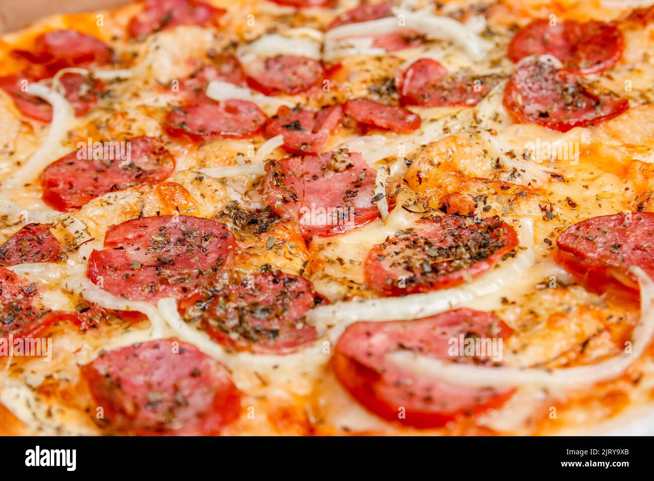 Round pepperoni pizza on a white table in Rio de Janeiro Stock Photo ...