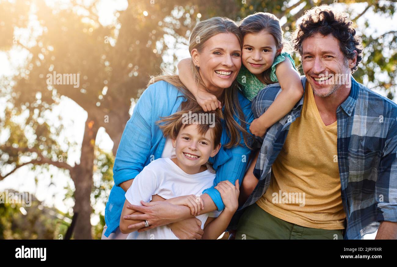 Our family is complete. Portrait of a happy family spending time ...