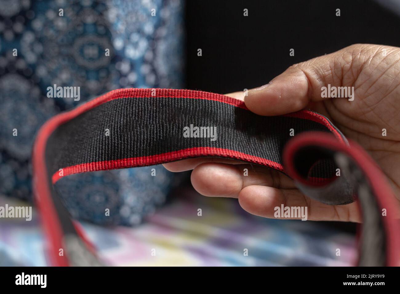 black camera strap with red detail in rio de janeiro Stock Photo - Alamy