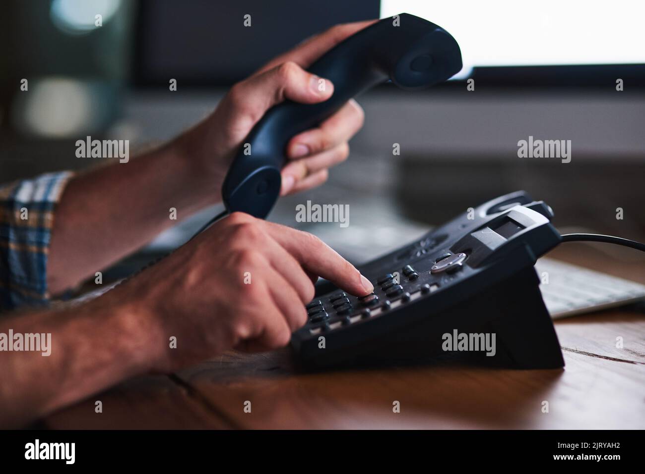 Keeping things old school. an unidentifiable businessman using a desk ...