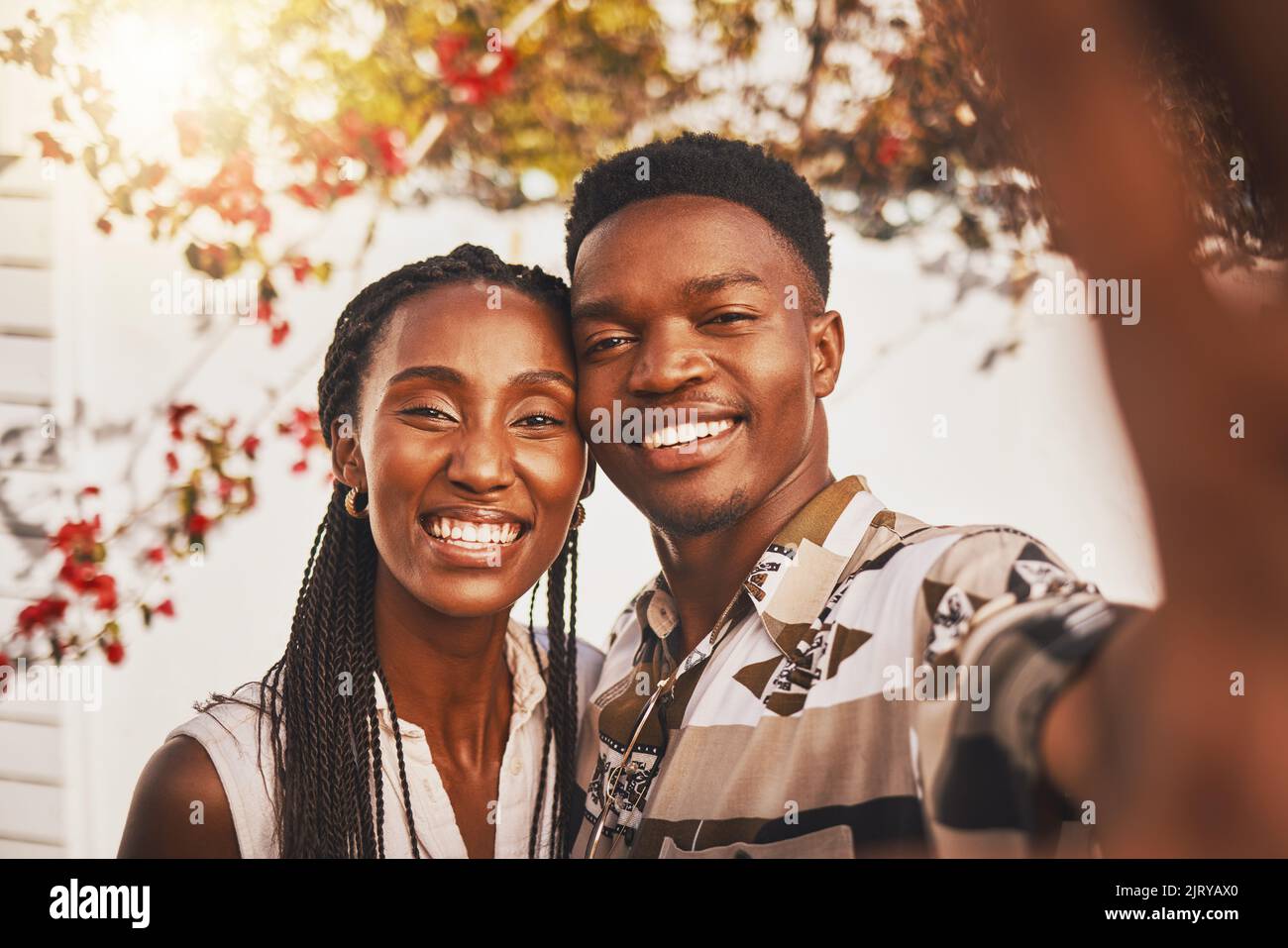 Selfie of happy black woman and man, couple in love on outdoor sunset date. Beautiful young ...