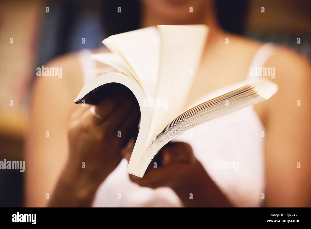 Hands reading books, paper and page in library, bookstore or home for ...