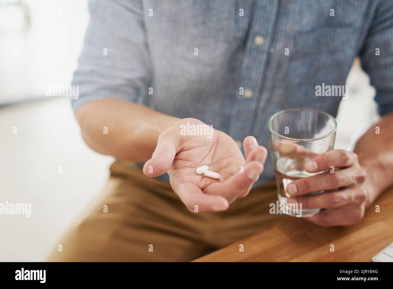Taking his prescribed treatment. Closeup shot of an unrecognisable man ...