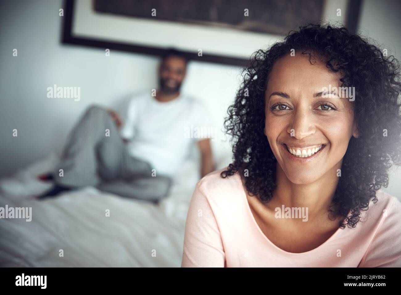 Woman sitting edge bed man hi-res stock photography and images - Alamy