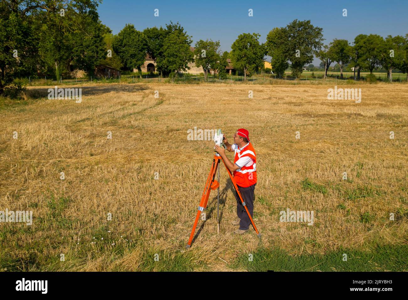 Land surveyor to measure land with survey equipment camera tool Stock ...